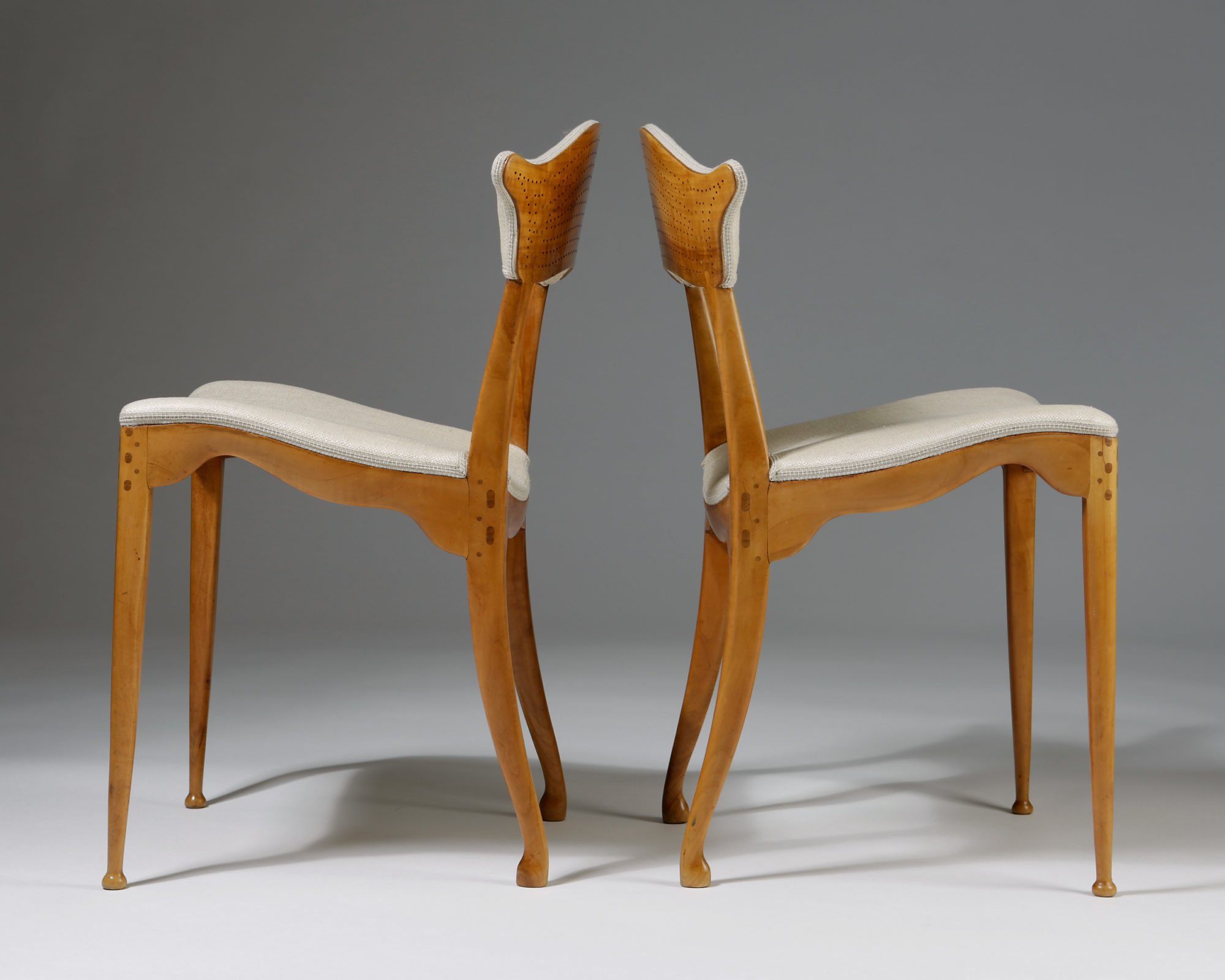 Two pierced back chairs designed by Peder Moos, Denmark. 1949. — Modernity