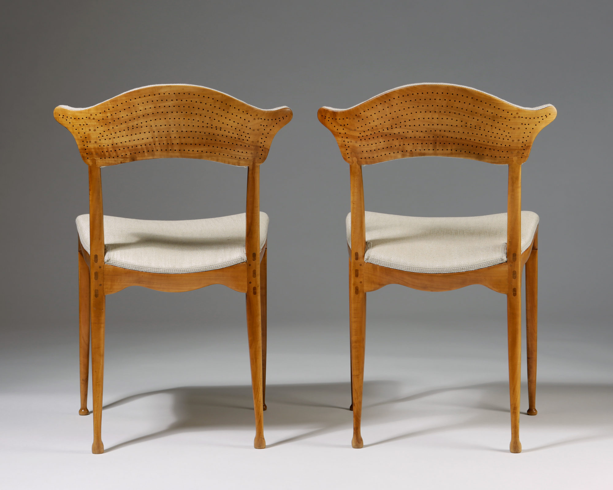 Two pierced back chairs designed by Peder Moos, Denmark. 1949. — Modernity