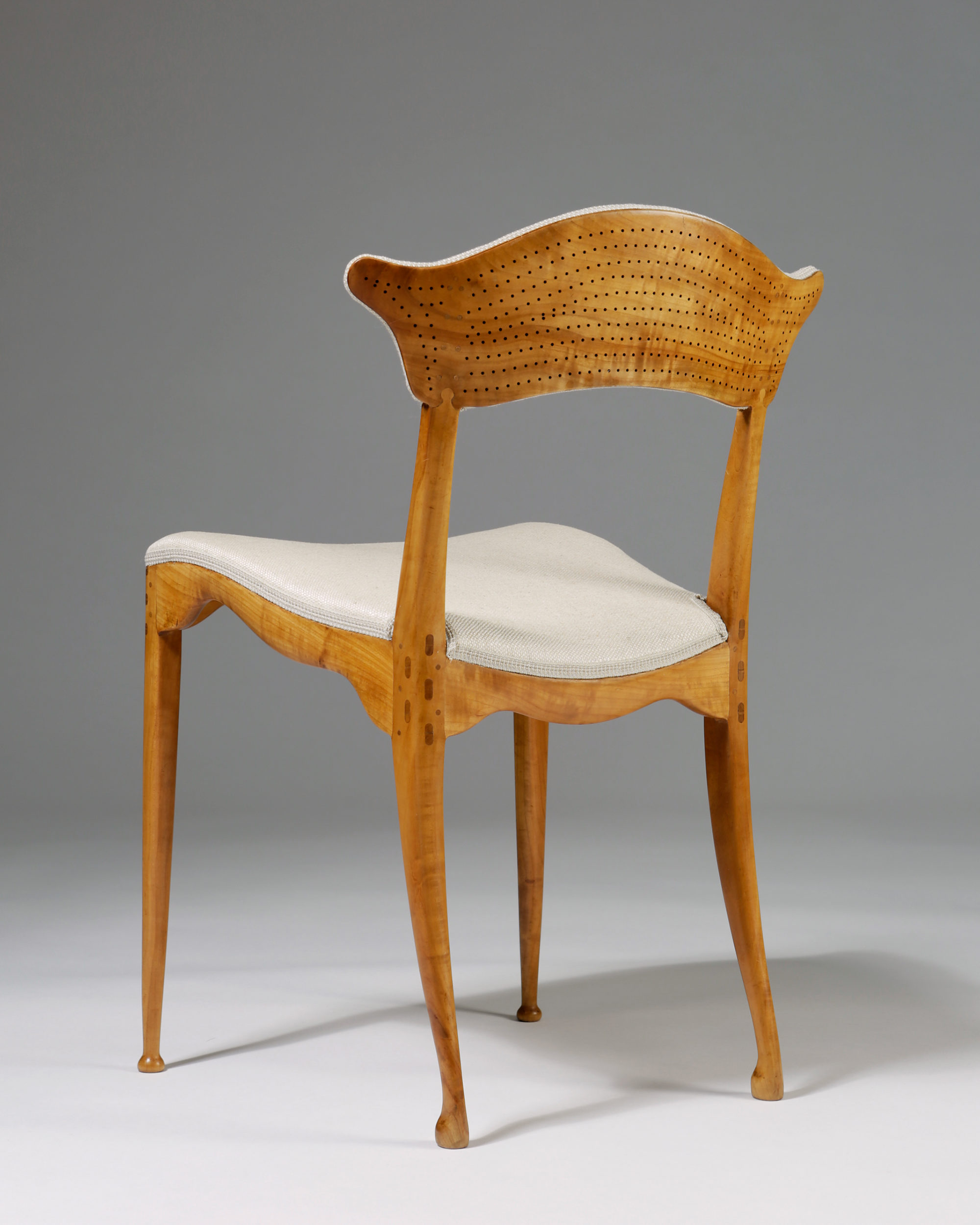 Two pierced back chairs designed by Peder Moos, Denmark. 1949. — Modernity