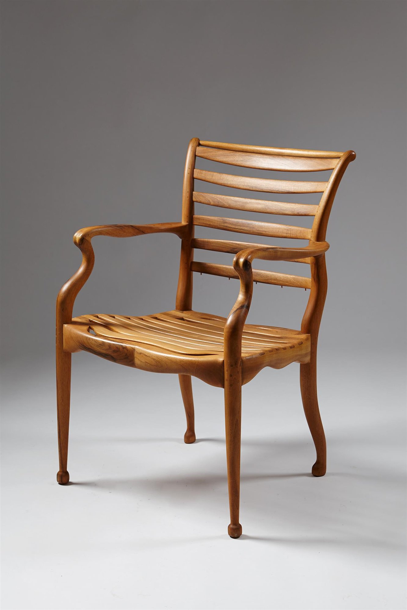 Armchair designed in 1949. Solid hand carved walnut